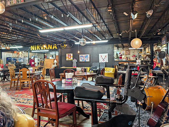 The "Nirvana" sign isn't lying—this room is heaven for vintage furniture lovers. Kurt Cobain references aside, this space hits all the right nostalgic notes.