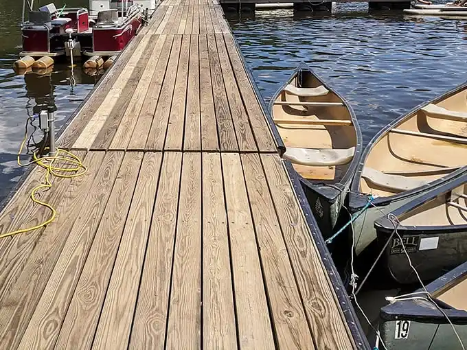 Canoes waiting patiently at the dock like eager puppies hoping you'll pick them for an adventure.