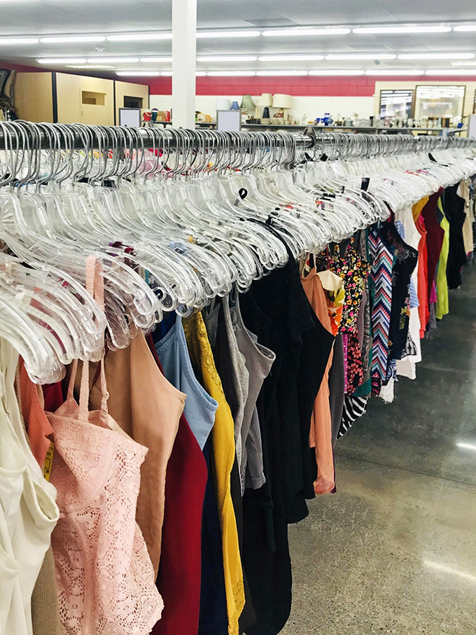 Color-coded clothing creates a rainbow of possibilities. Each hanger holds potential—perhaps that perfect summer dress or professional blouse waiting for its second act.