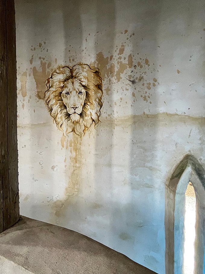 This majestic lion mural watches over visitors with the quiet dignity of a medieval guardian.