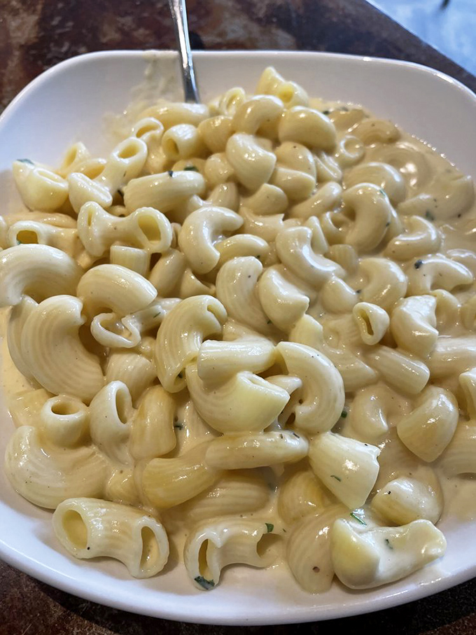 Mac and cheese so creamy it should require a lifeguard on duty. This isn't your childhood boxed dinner—it's what grew up to be fabulous.