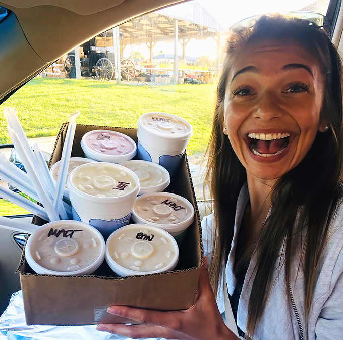 Ice cream alchemy in labeled containers—proof that happiness can, in fact, be packaged, transported, and shared with friends.