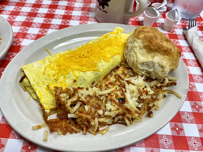 The perfect omelet isn't just about ingredients—it's about engineering. This cheese-topped masterpiece with crispy hash browns proves Angie's has the blueprint.