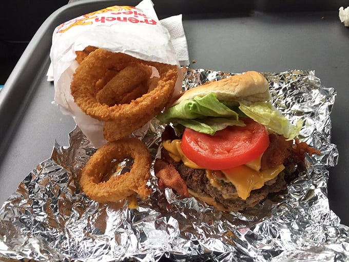 Golden-brown onion rings that shatter with each bite, proving that vegetables can indeed be transformed into something transcendently delicious.