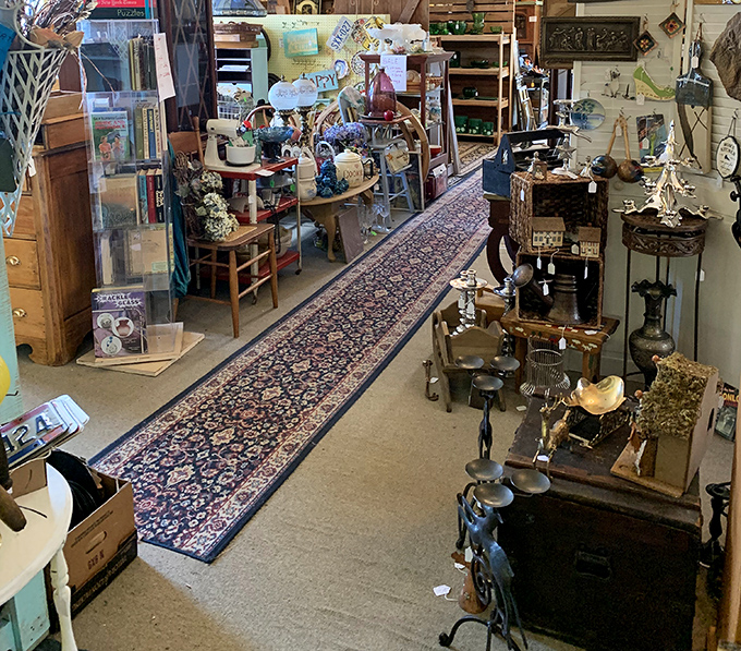 This booth looks like someone emptied their grandparents' attic after three generations of collecting—in the most wonderful way possible.