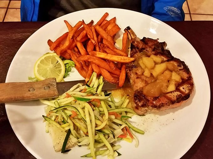 This pork chop with apple compote isn't just dinner—it's edible therapy. The sweet-savory combo alongside those vibrant vegetables is a masterclass in balance.