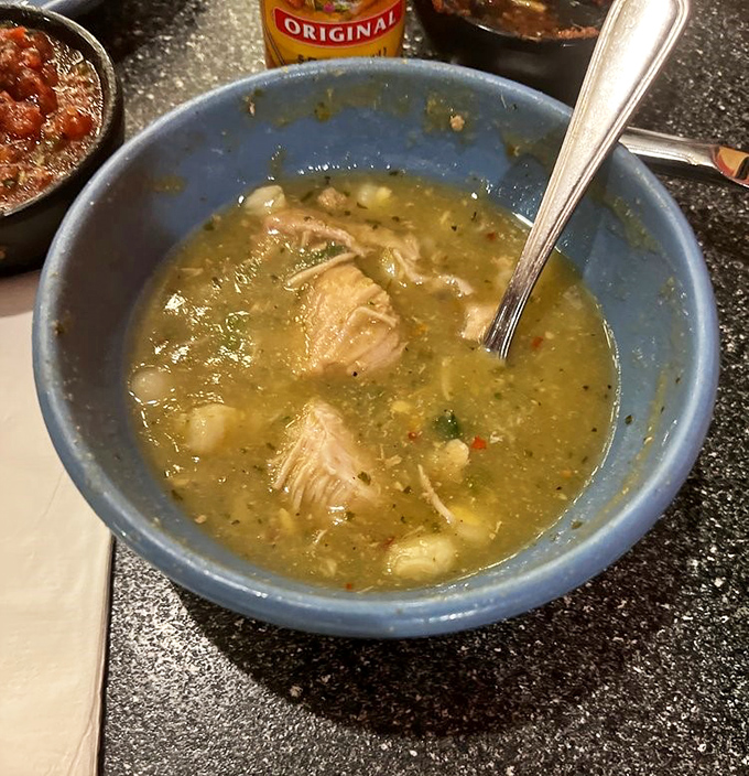 This isn't just soup—it's liquid comfort. Tender chunks of pork swimming in a green chile broth that warms you from the inside out.