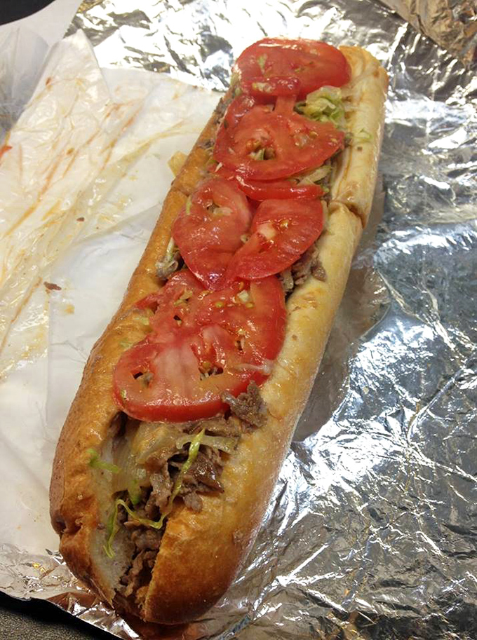 Fresh tomatoes glisten atop thinly sliced meat like rubies on a sandwich crown. This is what sandwich poets write sonnets about.