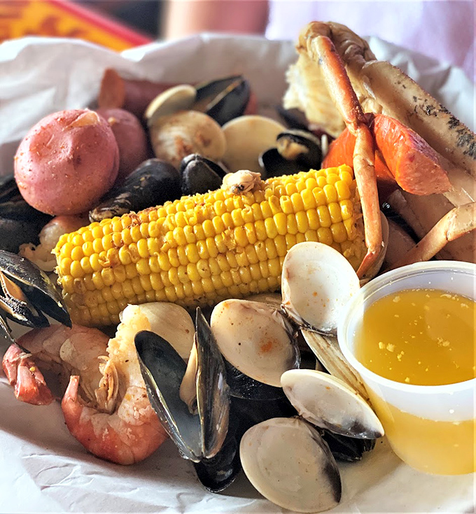 This seafood boil looks like Neptune's personal feast, complete with corn and melted butter bliss.