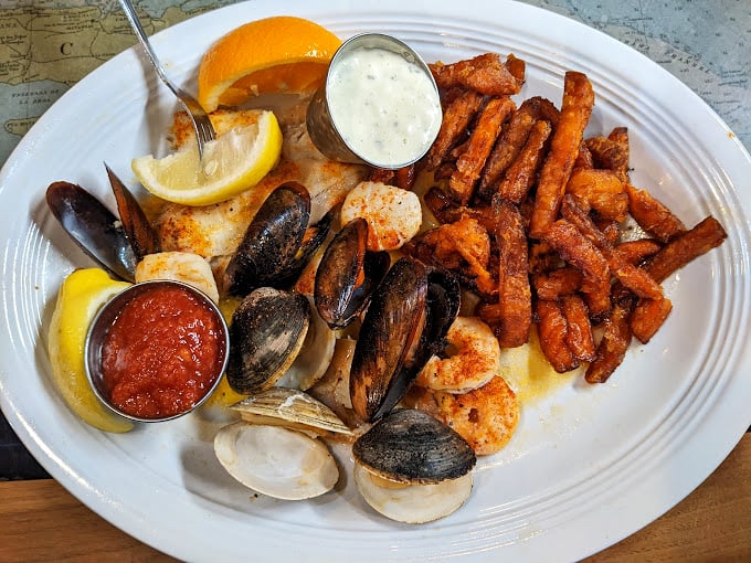 A seafood medley that brings together clams, mussels, shrimp, and fish with perfect harmony—like the ocean's greatest hits album on a plate.