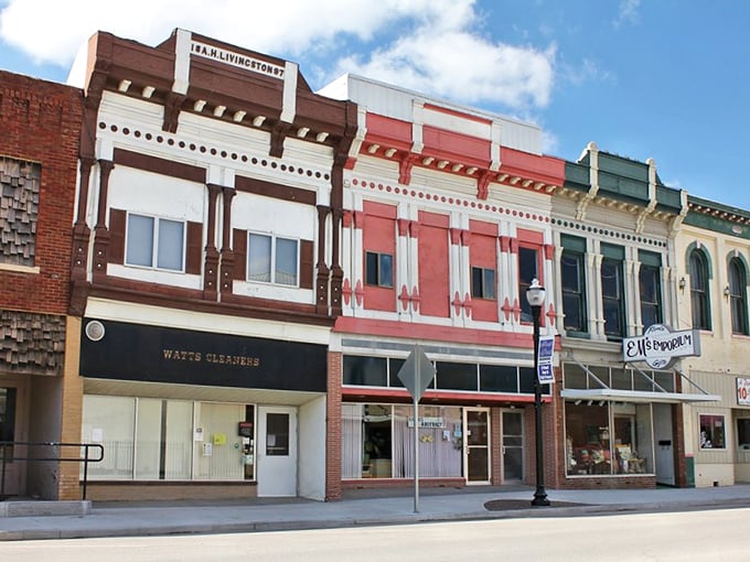These historic storefronts have witnessed over a century of commerce, gossip, and community life – their colorful facades like a timeline of American small-town evolution.