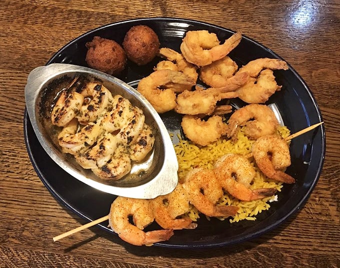 A seafood medley that makes decision-making unnecessary. Grilled scallops, golden shrimp, and fluffy rice—the holy trinity of Florida seafood satisfaction.
