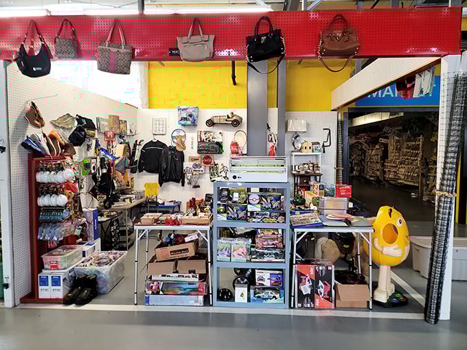 Designer handbags hang like exotic fruit from the ceiling of this eclectic booth. Below, a chaotic treasure map of possibilities awaits the patient explorer.