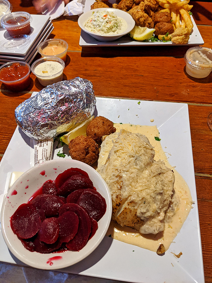 A plate that screams "Florida!" louder than a retiree who just found a great early bird special—perfectly prepared fish with colorful, fresh sides.