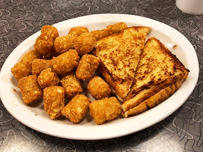 Tater tots and grilled cheese—the dynamic duo that proves comfort food doesn't need to be complicated to be extraordinary.