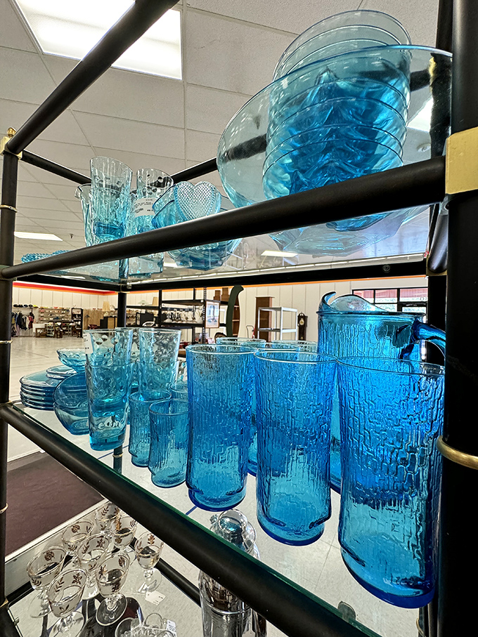 That electric blue glassware could turn ordinary lemonade into a royal experience. Mid-century entertaining never went out of style.