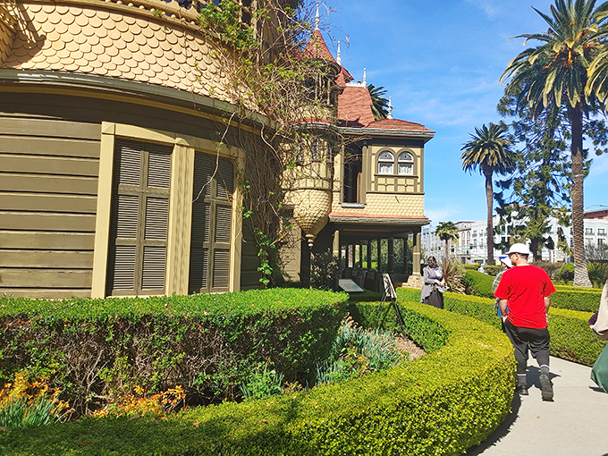 Fellow explorers navigate the grounds, probably wondering if they're still in the same dimension they started in.