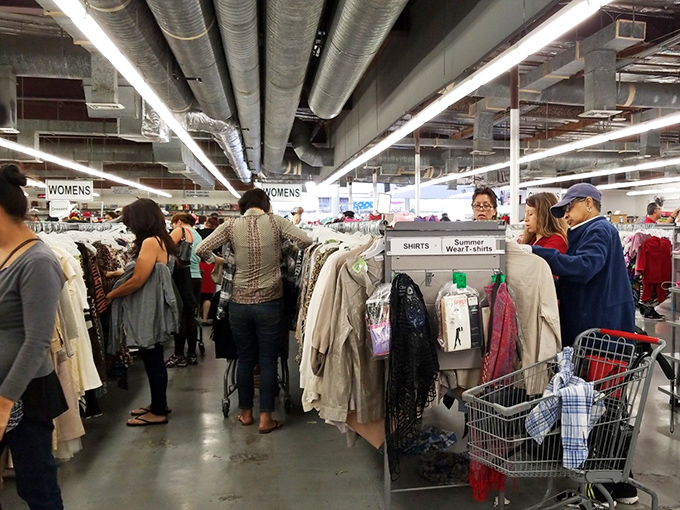 Shoppers navigate the women's section like archaeologists, carefully sifting through layers of fashion history to unearth that perfect piece.