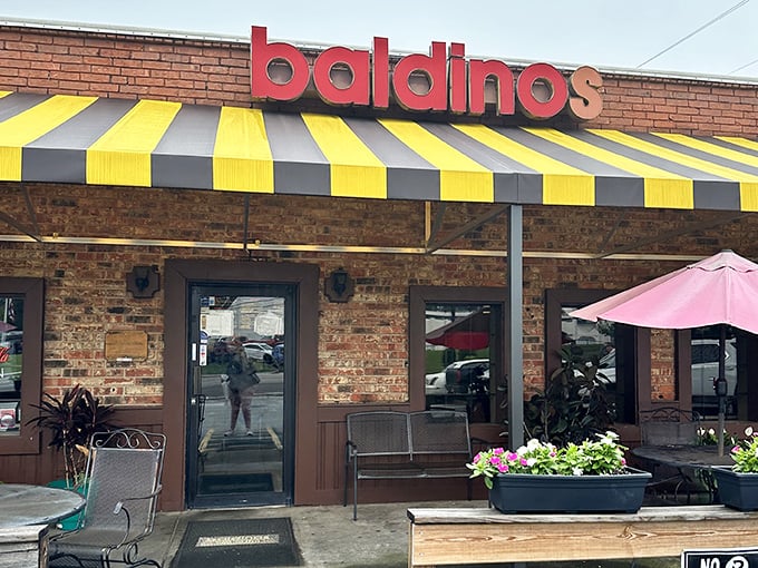 That yellow and black striped awning isn't just eye-catching – it's nature's way of saying "serious sandwiches inside!" 