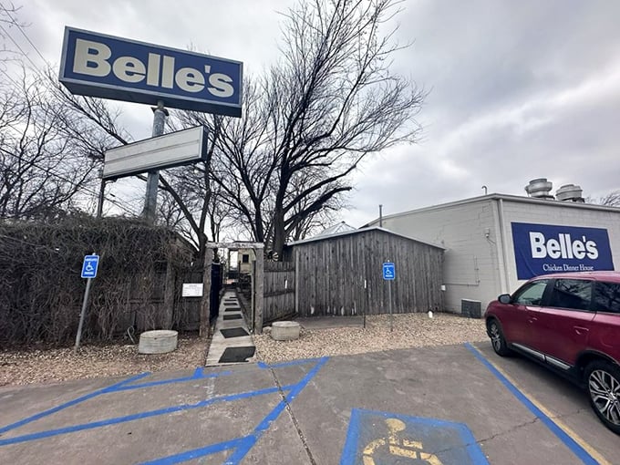 Don't let the humble exterior fool you—chicken legends are born in unassuming places. That sign stands tall like a promise.