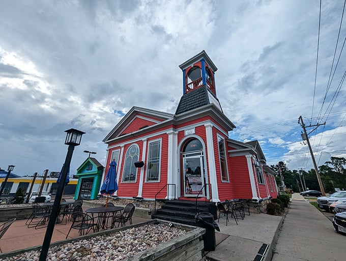 The Brat House Grill's cheerful red exterior stands out like a beacon for hungry Dells visitors. That tower isn't compensating—it's just excited about sausage!