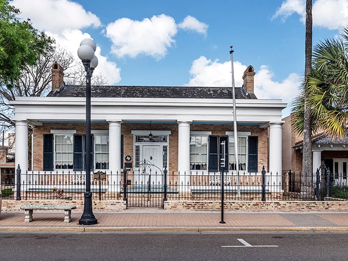 That historic home isn't just preserved – it's living and breathing Brownsville history with a white-columned smile.