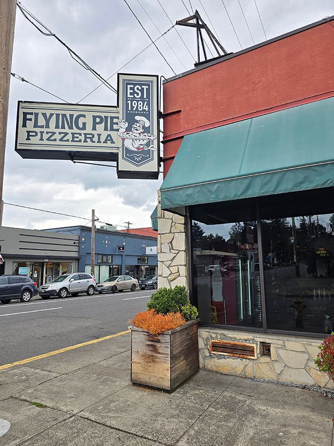 Flying Pie's vintage sign proudly displays its 1984 heritage—a Portland pizza institution that's outlasted countless food trends.