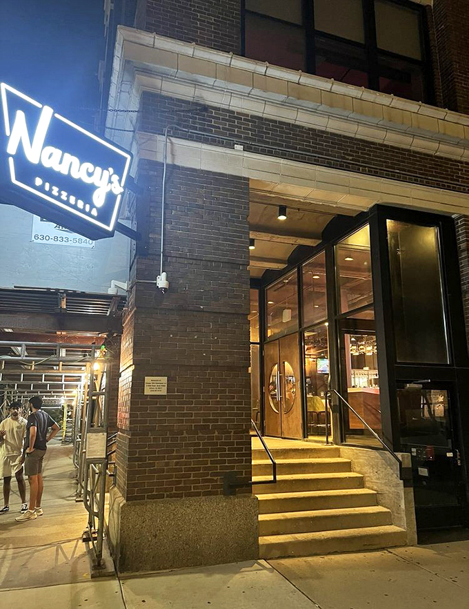 Nancy's modern entrance offers a sleek gateway to stuffed pizza paradise in Chicago's bustling West Loop.