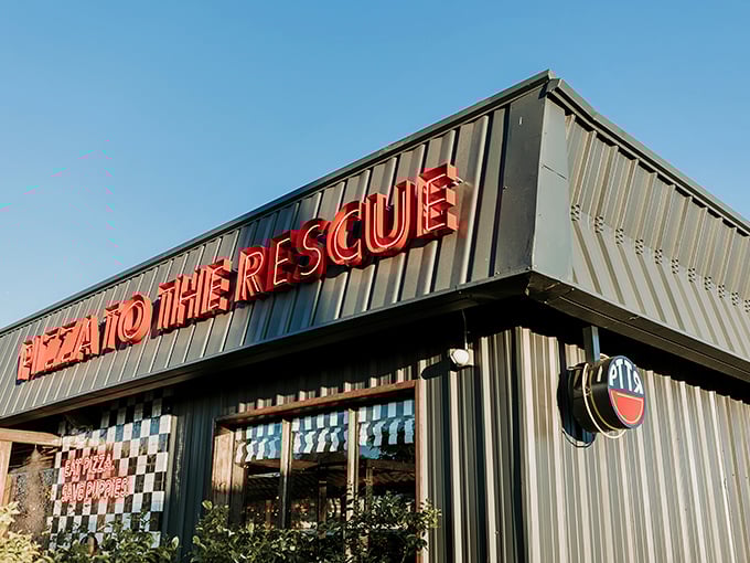 "Pizza To The Rescue" isn't just a clever name – it's a promise delivered in bold red letters against the Phoenix sky.