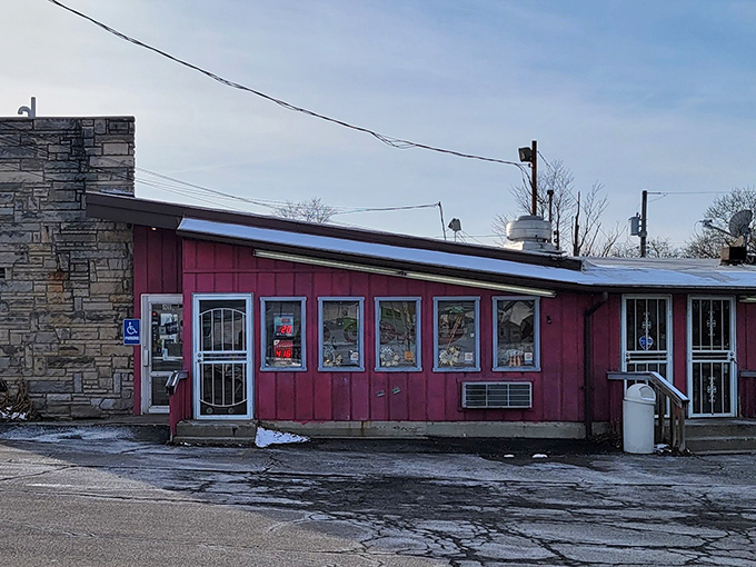 Porky's stone wall and pink siding combo is like the mullet of architecture—business in front, party in the kitchen.