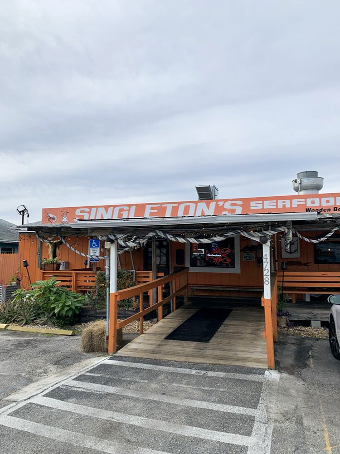 Singleton's vibrant orange exterior and weathered boat say "authentic fisherman's shack" before you taste a single shrimp.