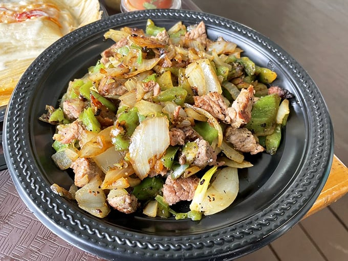 The Alambre de Filete combines steak, peppers, and onions in a sizzling conversation of flavors. Your fork won't know where to start.