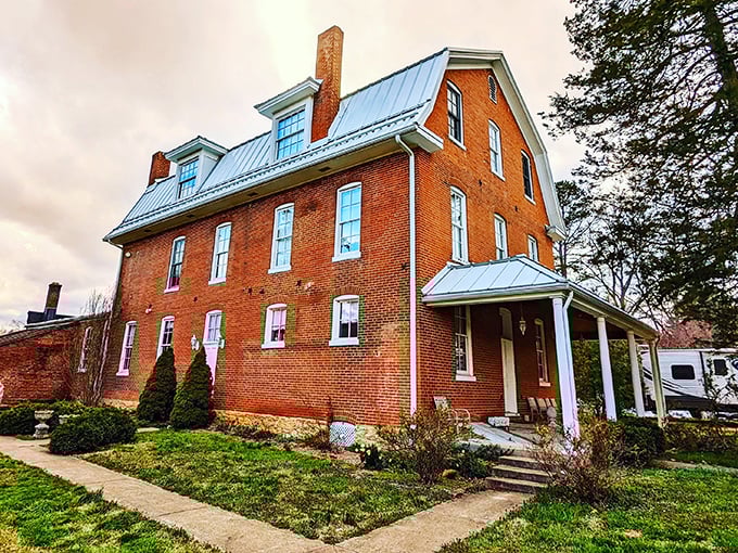 This stately brick building with its blue metal roof isn't just preserving architecture – it's safeguarding stories from another century.