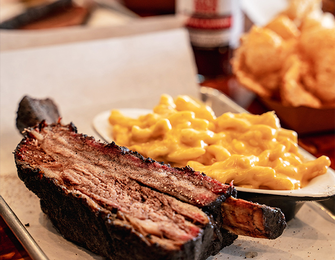 The marriage of golden mac and cheese with bark-crusted brisket is the culinary equivalent of finding your soulmate.