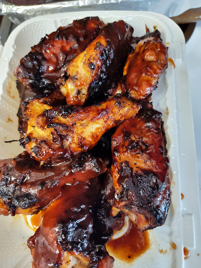 These wings aren't playing games. They've committed fully to their smoky destiny, and that sticky, caramelized exterior is the trophy they've earned.