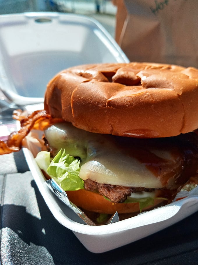 This isn't just a burger—it's edible architecture. The melted cheese cascading down those patties would make Frank Lloyd Wright weep with joy.