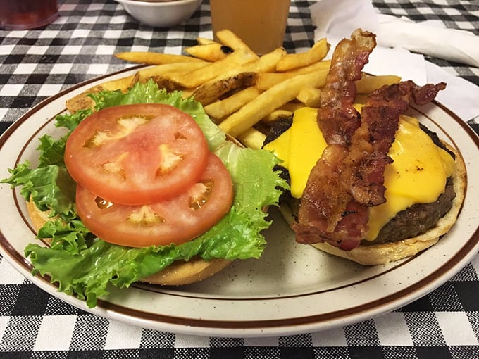 This isn't just a burger—it's a masterpiece of melted cheese, crispy bacon, and a perfectly toasted bun that requires both hands and zero shame.