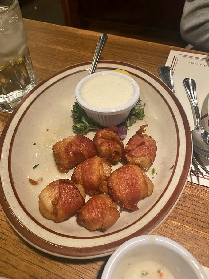 Bacon-wrapped scallops—where smoky meets sweet in perfect harmony. That dipping sauce isn't just an accompaniment; it's a flavor revelation.