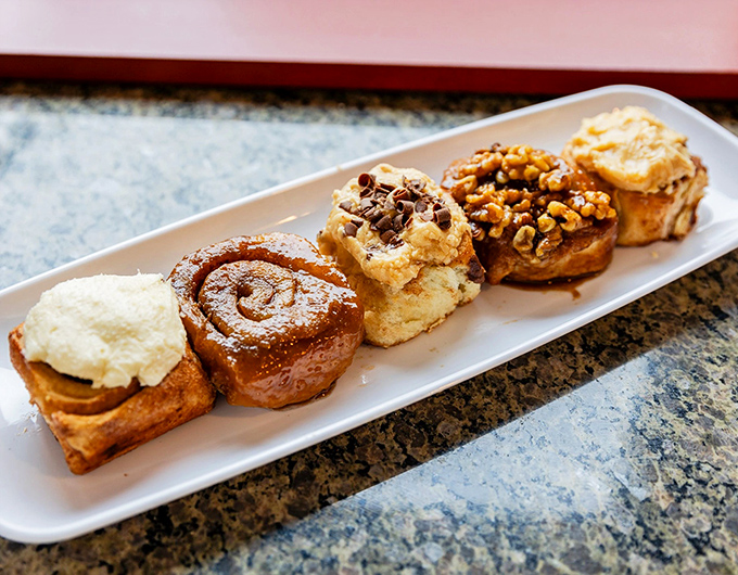 The sticky bun sampler plate—or as I call it, "Why choose when you can have it all?" Each variety offers a different pathway to bliss.
