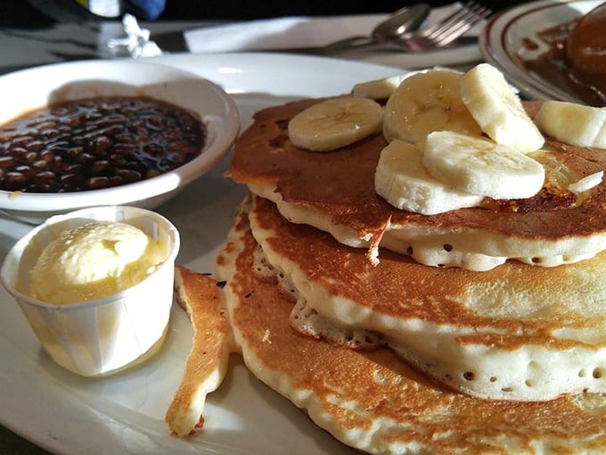 These pancakes aren't just breakfast—they're dessert with permission. Topped with fresh bananas and ready for their maple syrup baptism.
