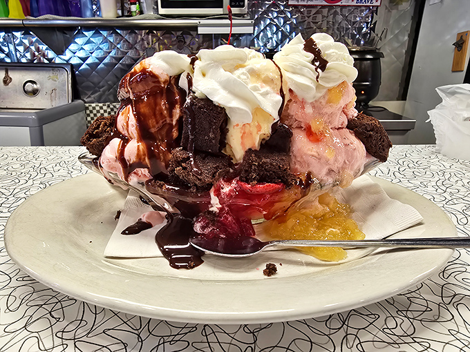 This banana split isn't just dessert—it's an architectural marvel of ice cream, chocolate, and whipped cream that requires both a spoon and a strategy.