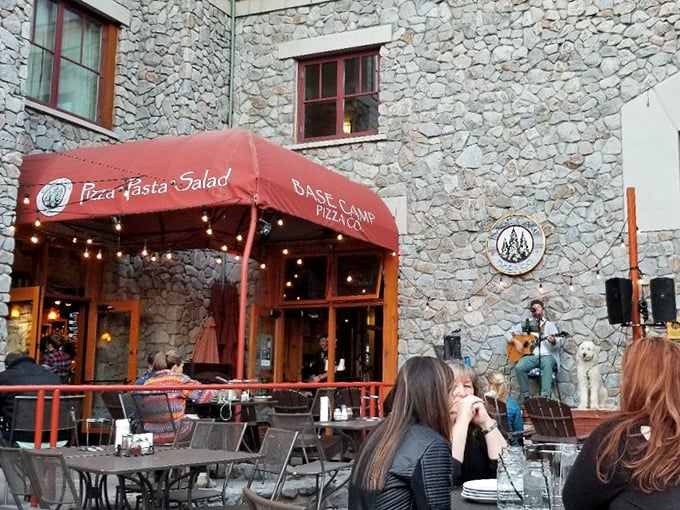 At Base Camp Pizza Co., outdoor dining comes with a side of live music and mountain air – the kind of atmosphere that makes even plain cheese taste extraordinary.