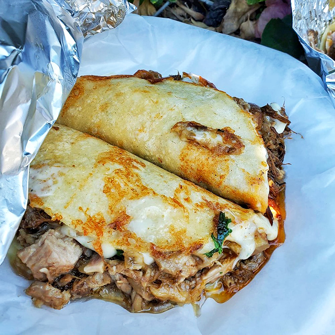 The mulita brings together crispy tortillas, melted cheese, and carnitas in a sandwich-like creation that makes you wonder why you'd eat anything else.