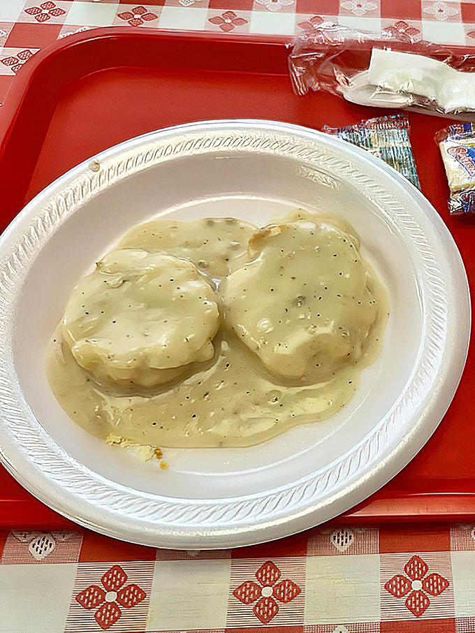 Biscuits swimming in creamy gravy—a Southern breakfast tradition that makes Monday mornings bearable and Sundays even more divine.