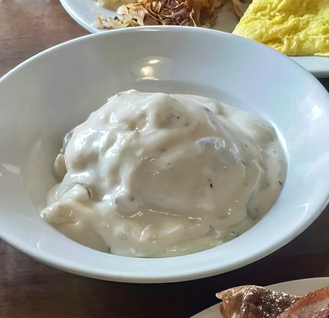 That gravy isn't just white sauce – it's a silky, peppery masterpiece that transforms ordinary biscuits into the breakfast of champions.