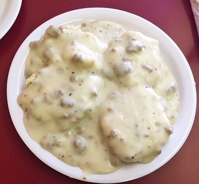 Biscuits drowning in sausage gravy – cardiologists hate this one simple trick for pure joy.
