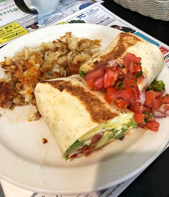 This breakfast burrito isn't messing around—packed with fresh salsa and enough filling to fuel your entire morning adventure.