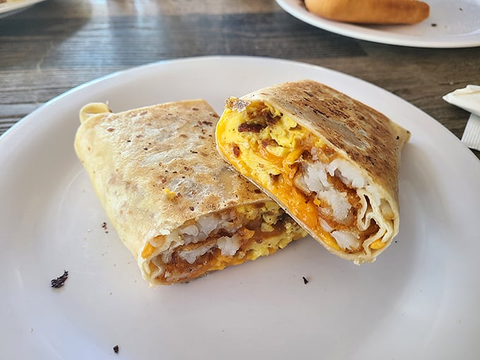 Breakfast burrito perfection meets classic diner omelet in this plate that screams "your diet starts tomorrow." Those home fries deserve their own fan club.