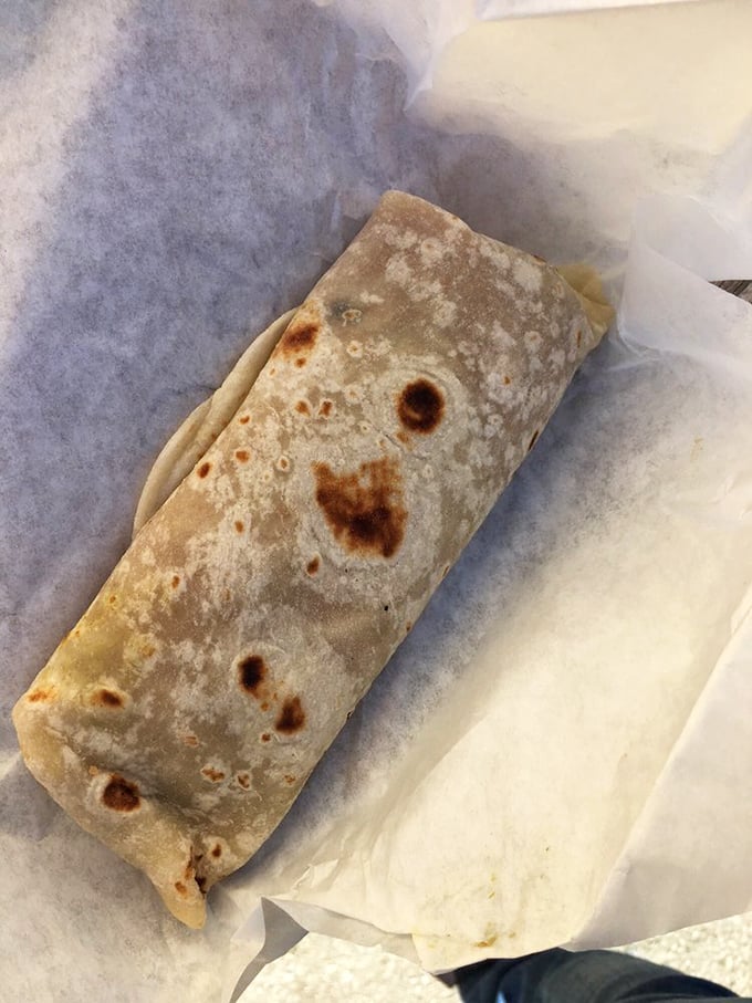 The breakfast burrito in its natural habitat: perfectly toasted, mysteriously spotty, and ready to cure whatever ails you.