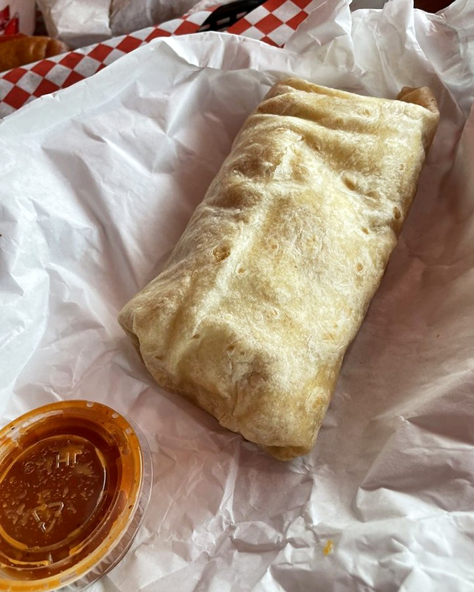A breakfast burrito wrapped tight like a delicious present you get to unwrap with every bite.